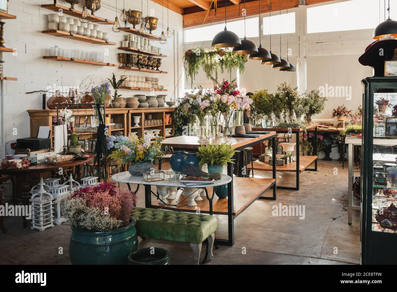 Interior of modern floral shop with various bouquets and decorative ...