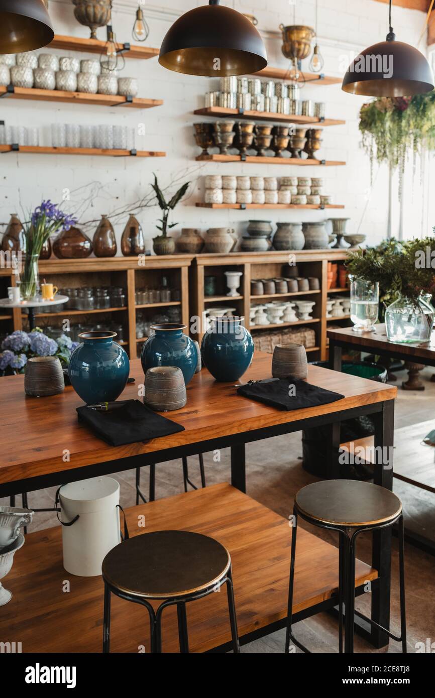 Interior of modern floral shop with various bouquets and decorative ...
