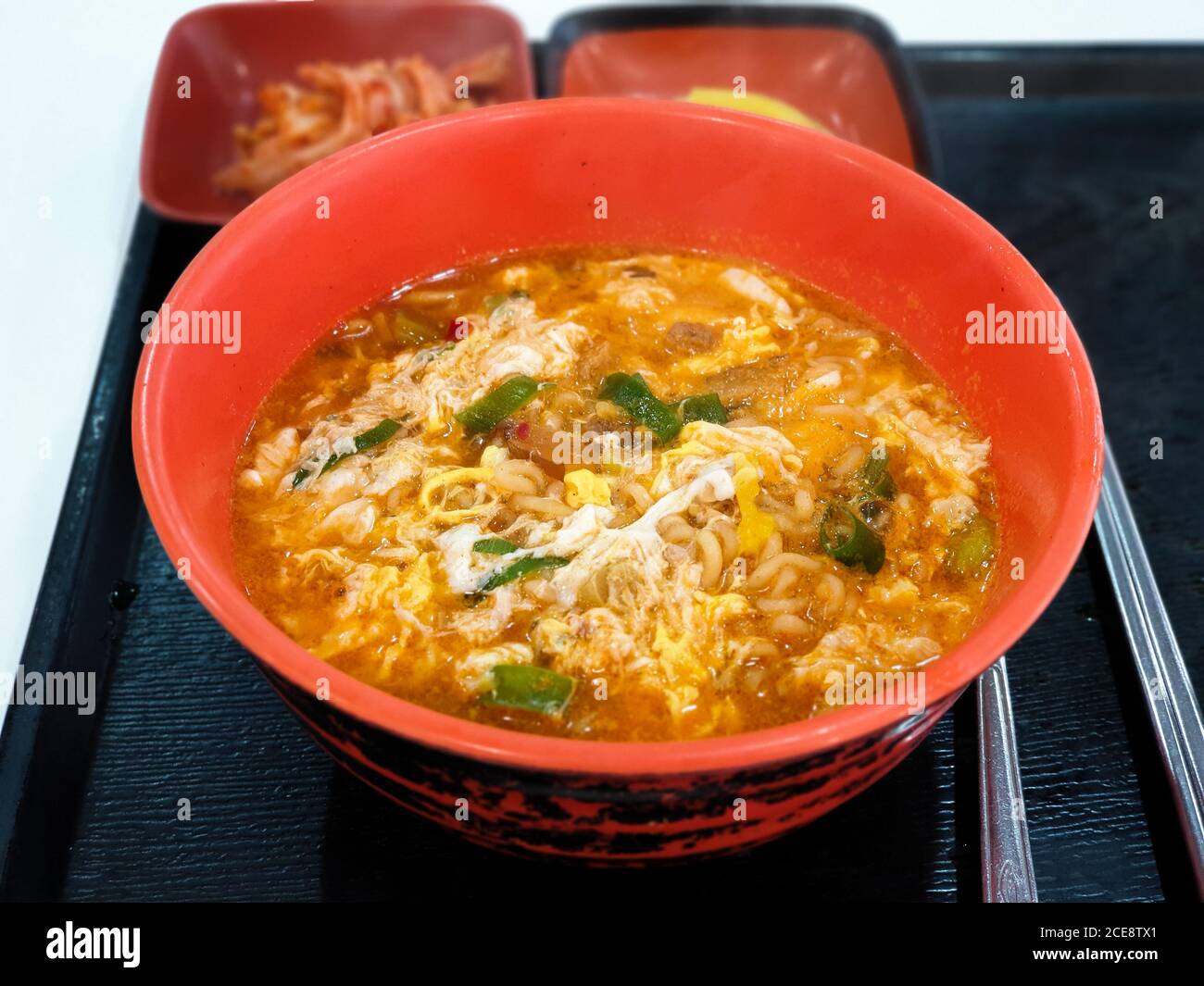 Ramyeon, Korean instant noodle dish. Red, spicy and salty, with egg ...