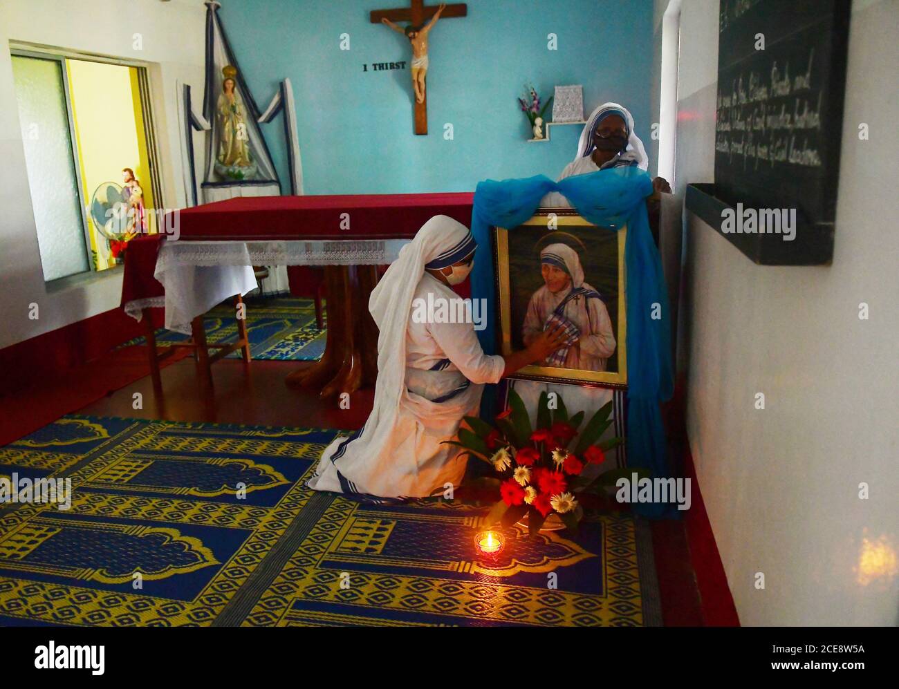 Catholic nuns from Nirmala Shishu Bhavan cleaning the photograph of ...