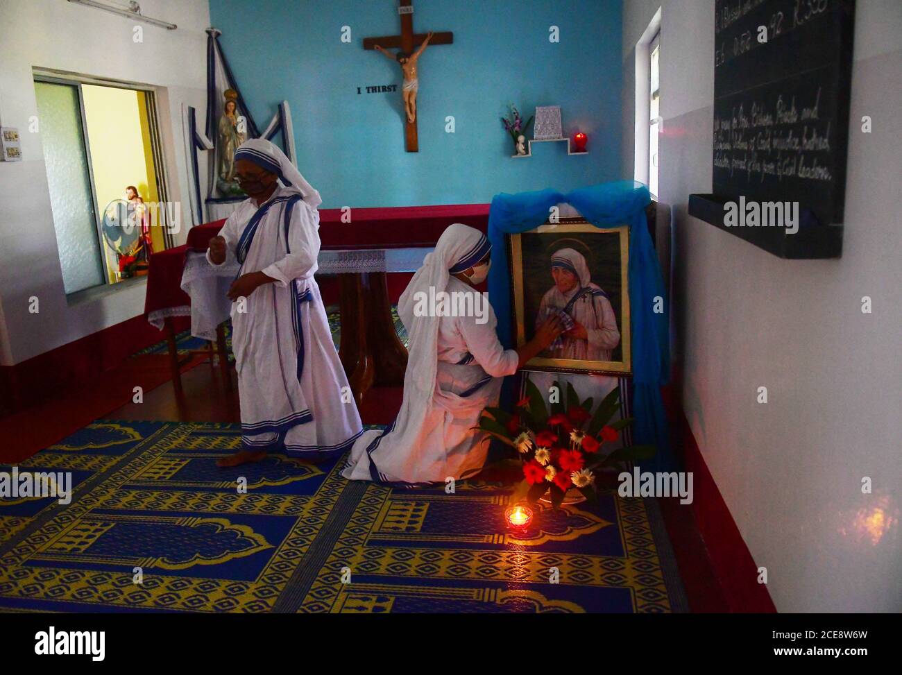 Catholic nuns from Nirmala Shishu Bhavan cleaning the photograph of ...