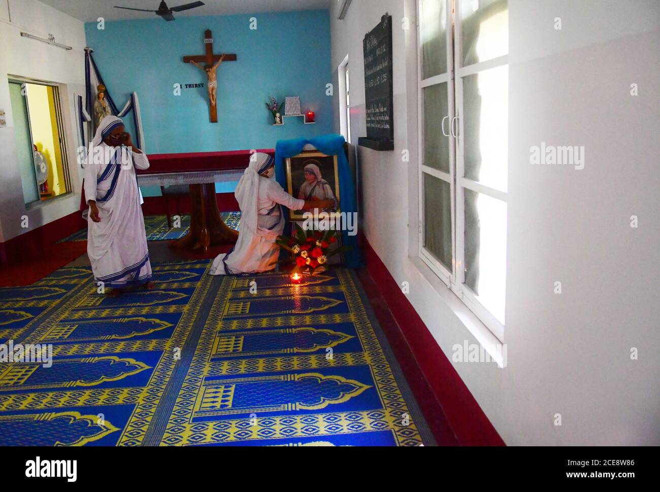 Catholic nuns from Nirmala Shishu Bhavan cleaning the photograph of ...