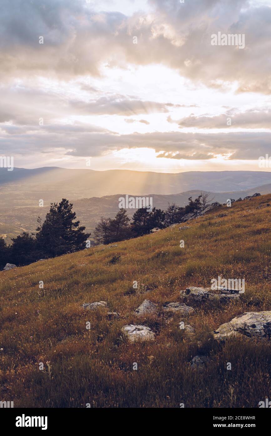 Majestic scenery of highland area under breathtaking sunset sky with ...