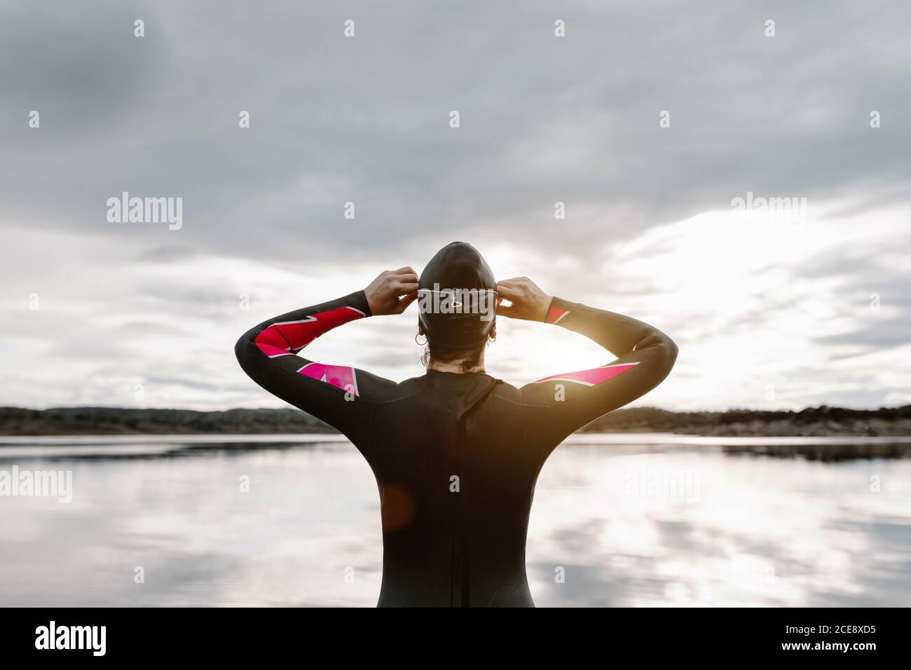 Back view of confident unrecognizable adult Woman in diving suit and ...