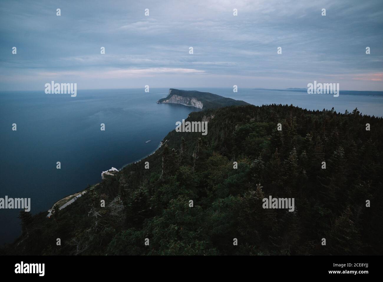 From above of rough cliffs covered with evergreen forest in endless ...