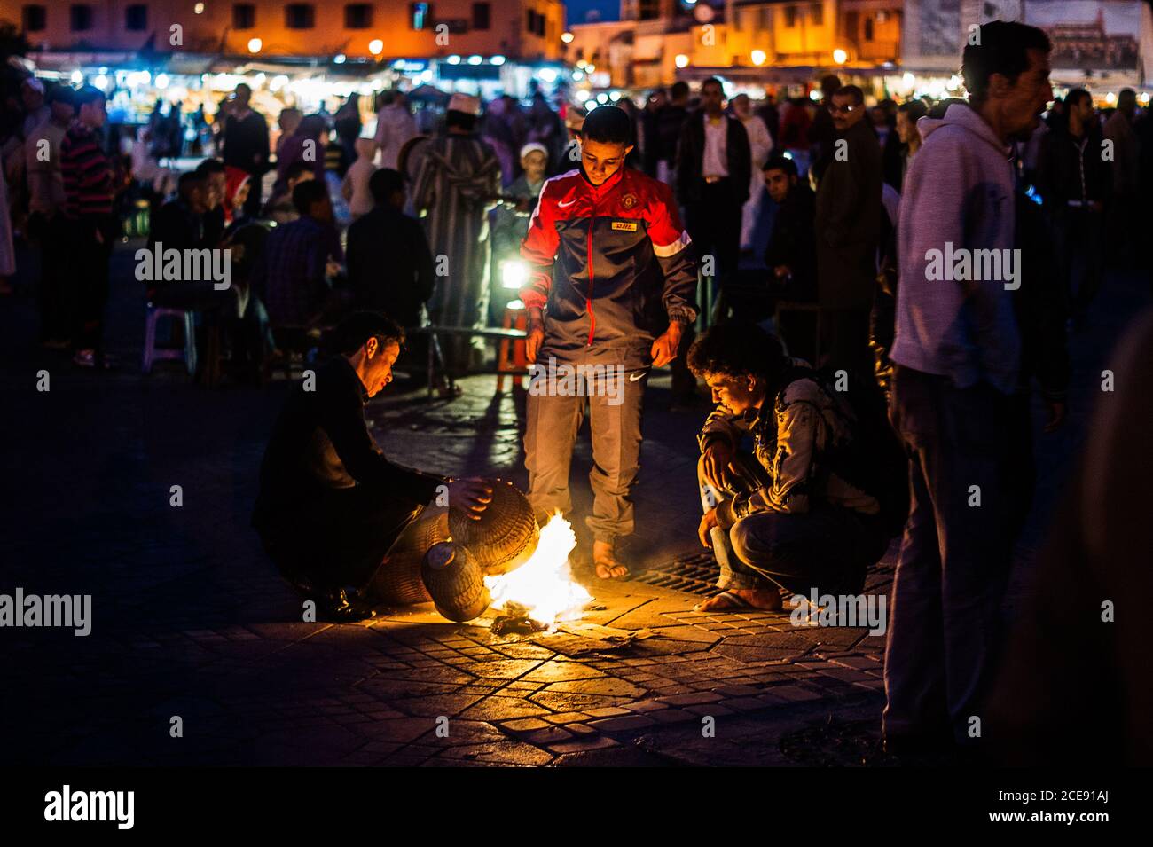 Marrakech - Morocco; 09-28-2012: Some young guys with a bonfire in the ...