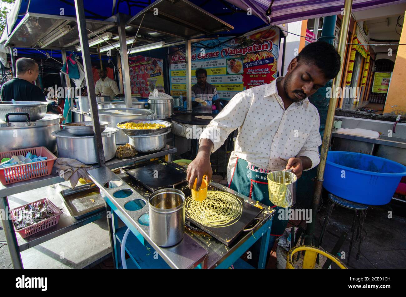 Georgetown, Penang/Malaysia - Aug 14 2016: Indian man cook the ...