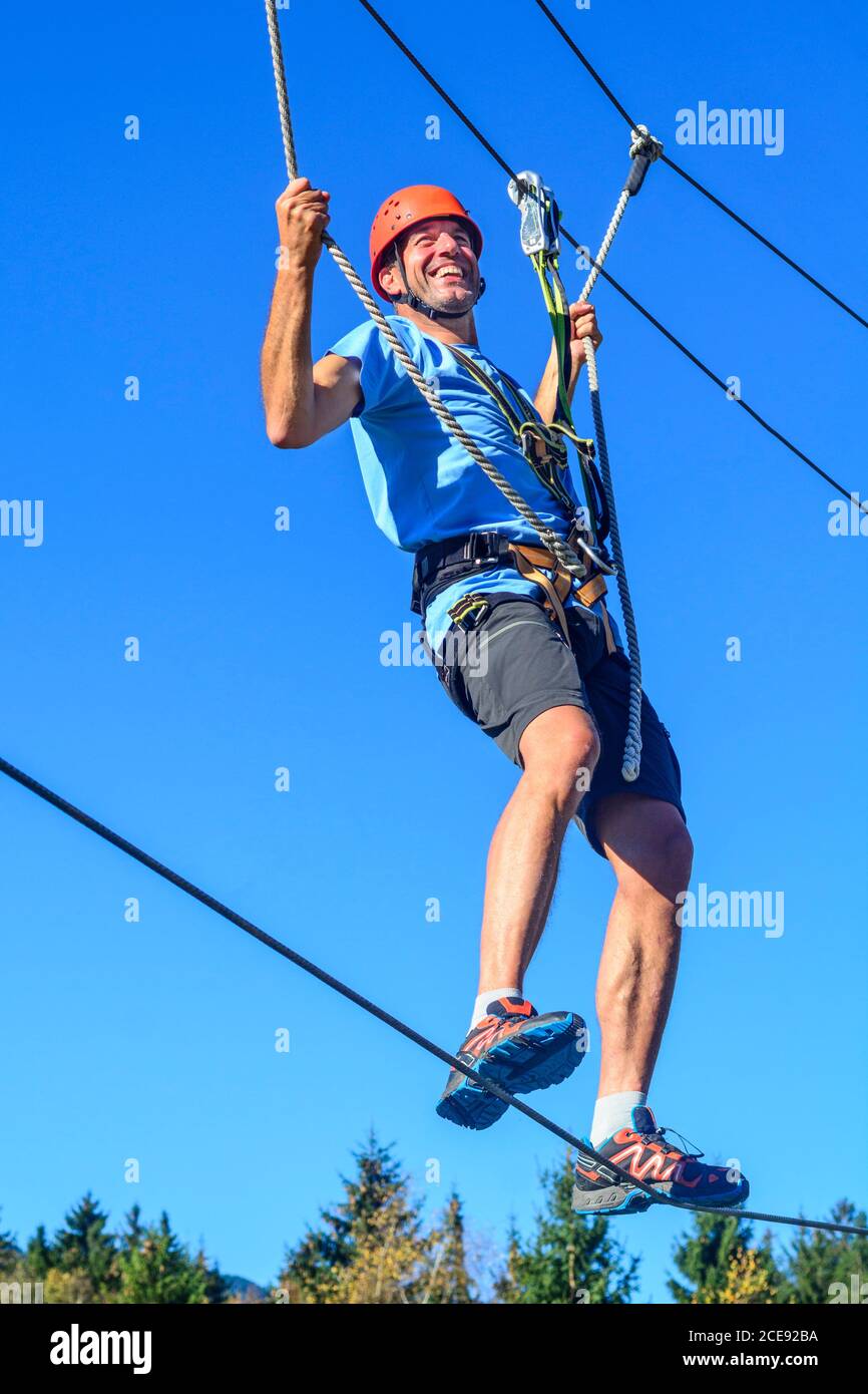 Man balancing on rope hi-res stock photography and images - Alamy