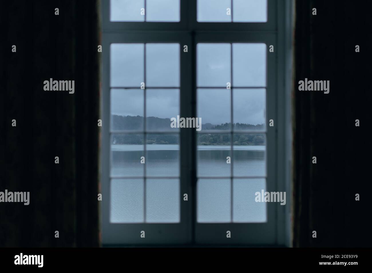 Lake and mountain through window Stock Photo - Alamy