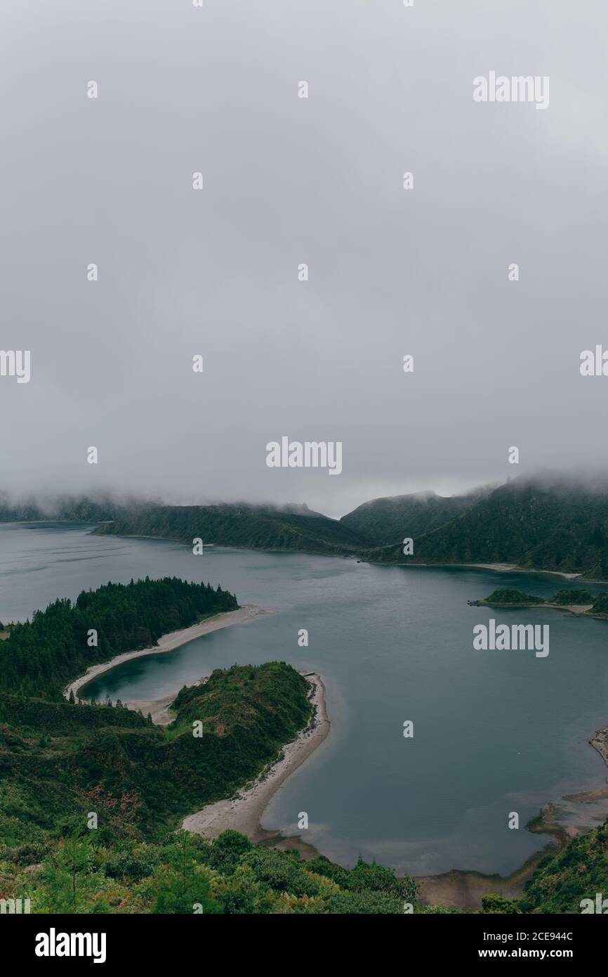 Lake with hilly coast Stock Photo - Alamy