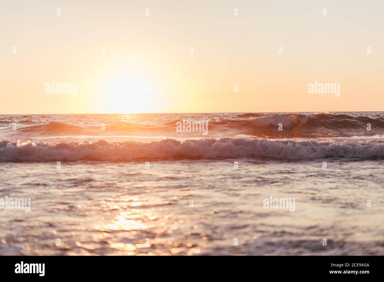 Ocean waves lit sunset hi-res stock photography and images - Alamy