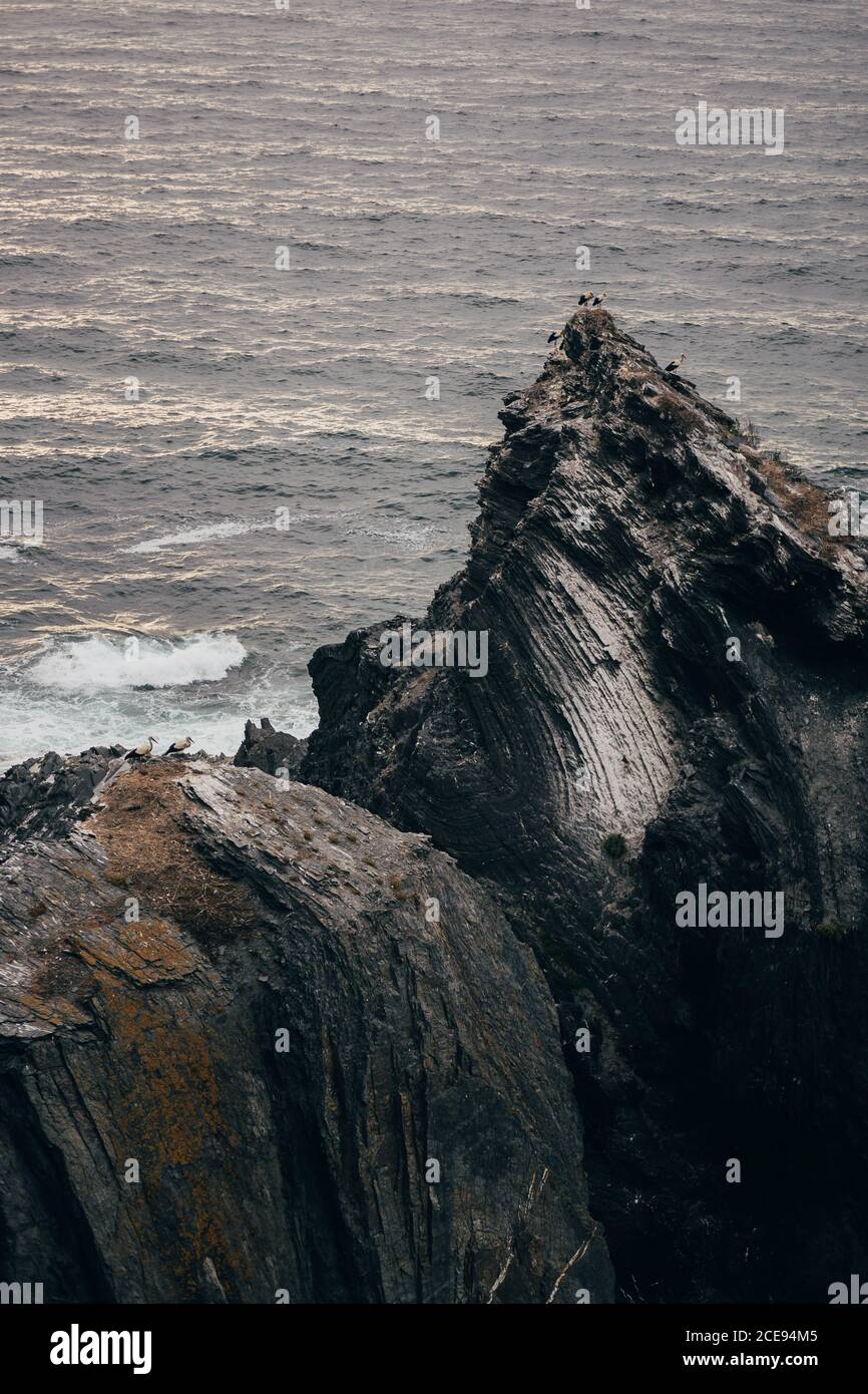 Rocky cliffs in ocean Stock Photo - Alamy
