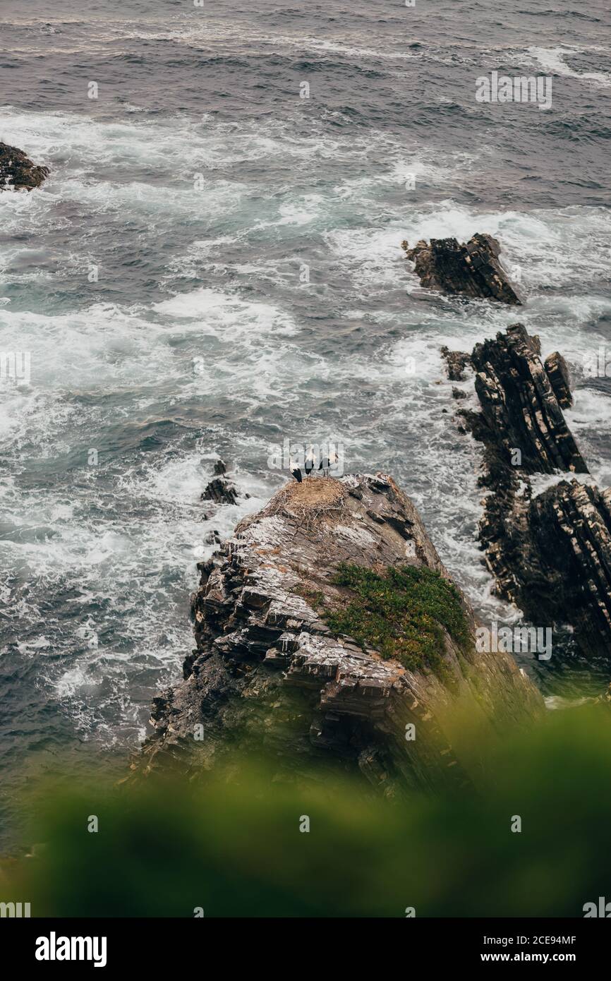 Rocky cliffs in ocean Stock Photo - Alamy