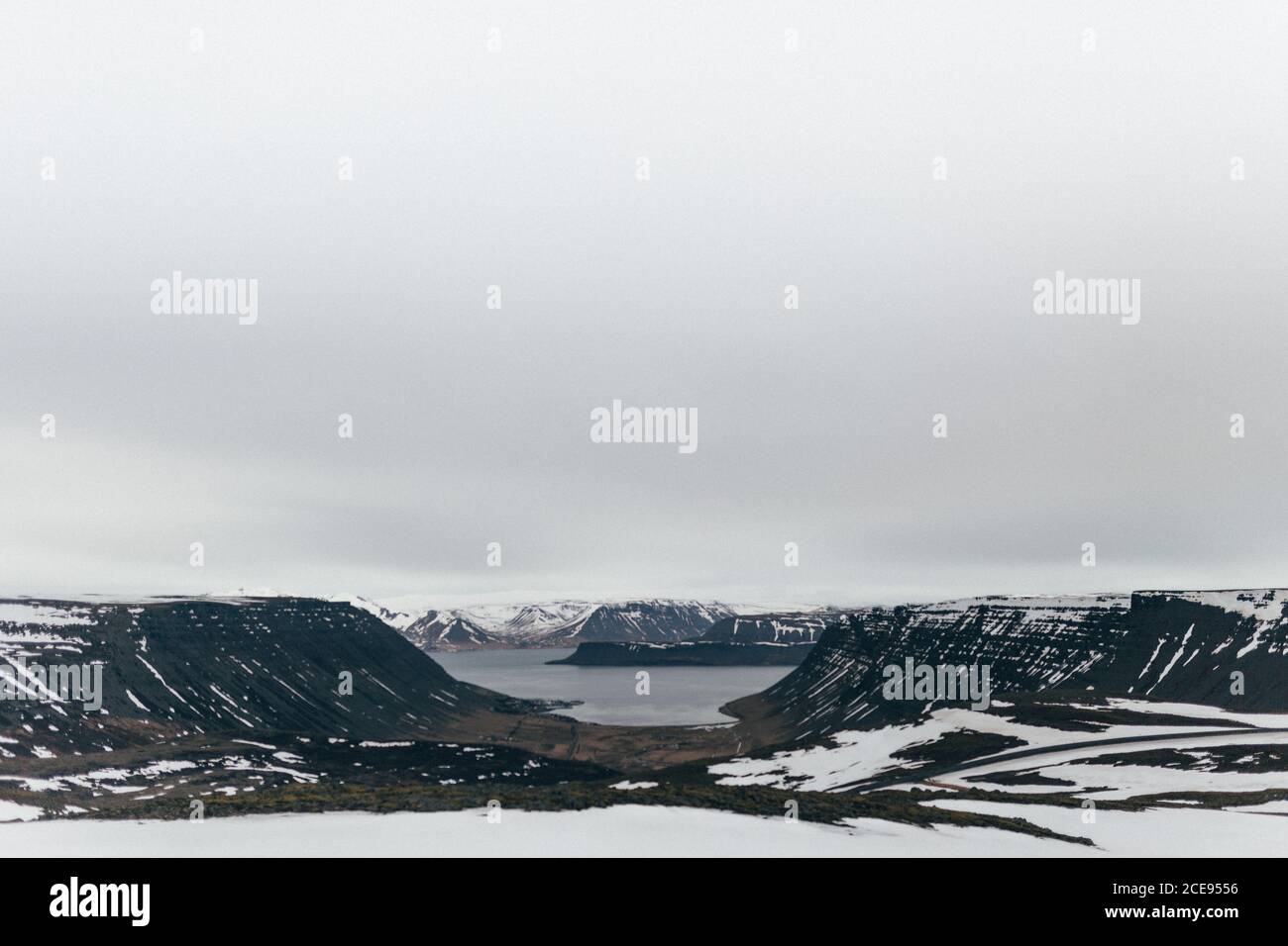 Aerial view of amazing land with snowy spacious terrain and mountains ...