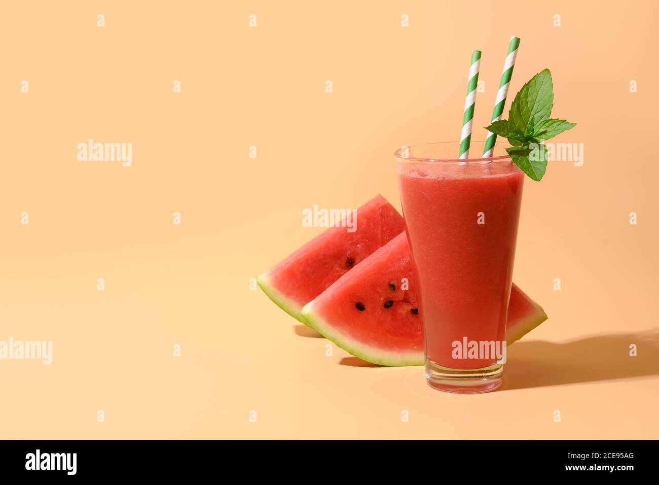 Watermelon smoothie with shadow on beige. Close up Stock Photo - Alamy