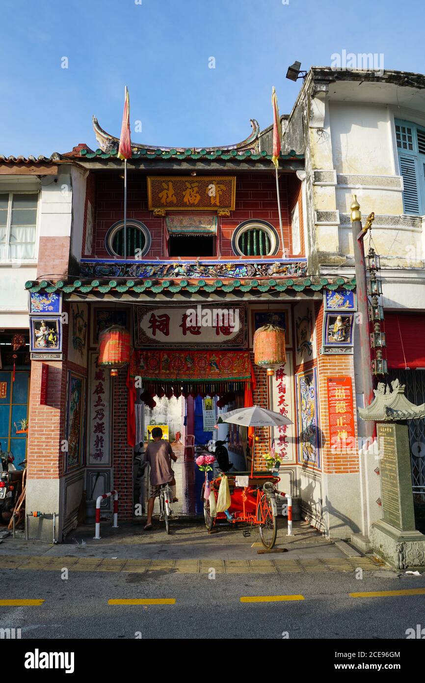 Georgetown, Penang/Malaysia - Sep 12 2016: A man ride the bicycle into ...