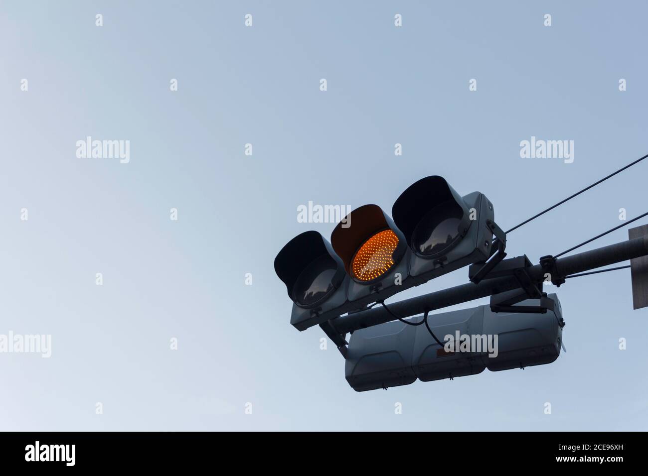 Yellow traffic light ,isolated on sky background Stock Photo - Alamy