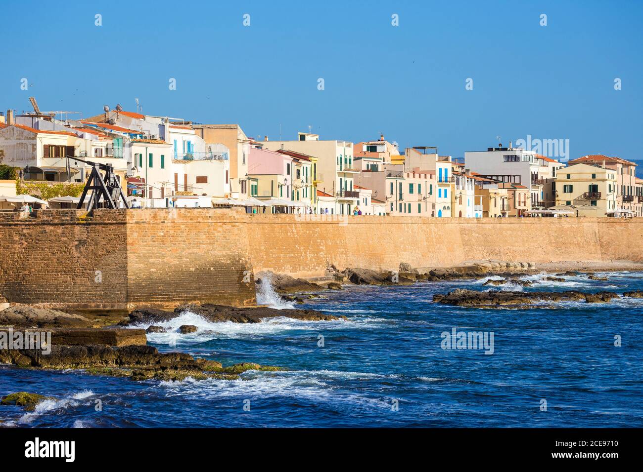 Italy, Sardinia, Alghero, View of ancient city walls and the historical ...
