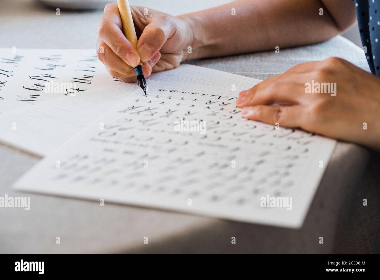 A young woman doing calligraphy Stock Photo - Alamy