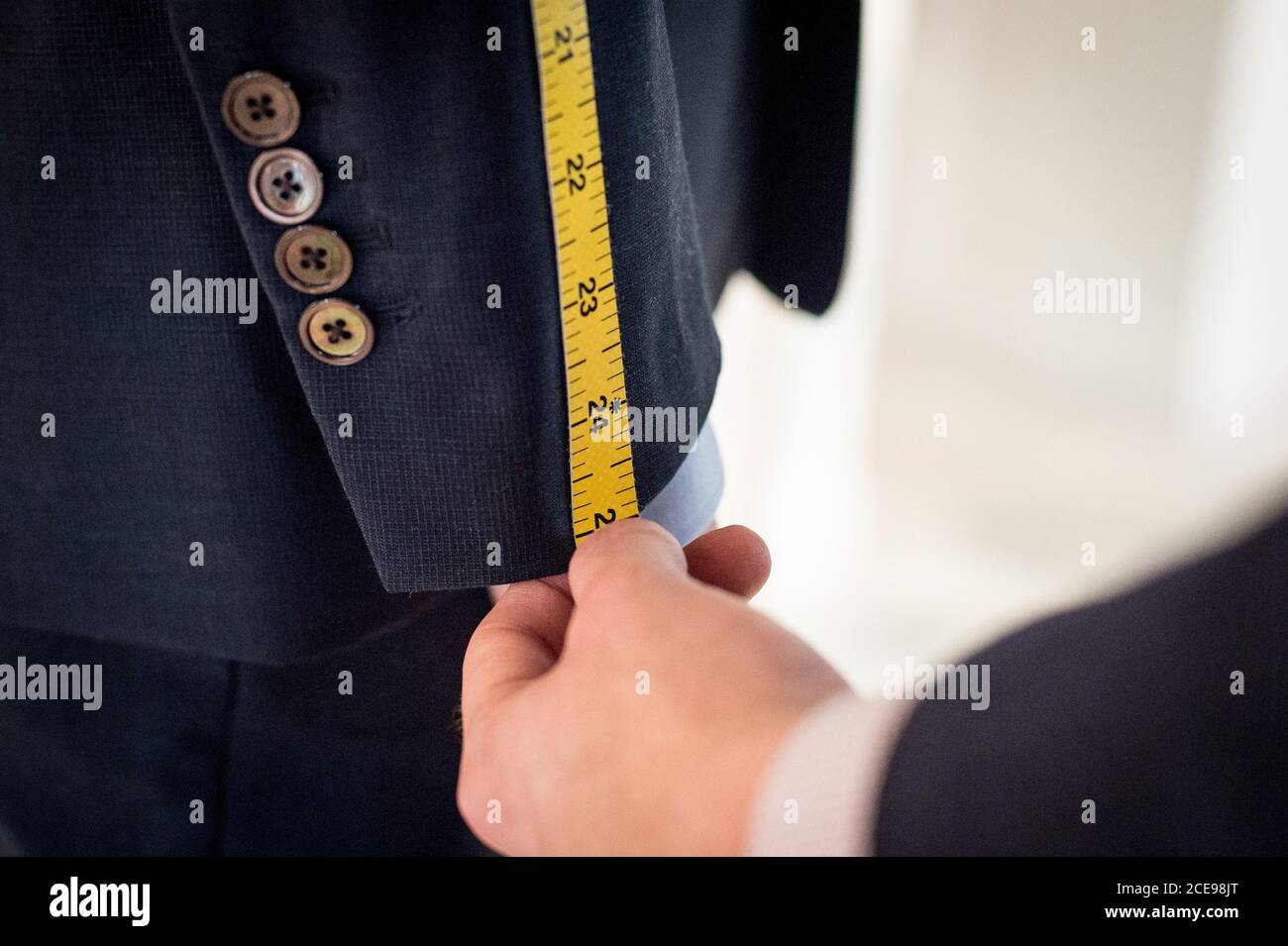 Measurement of chest for a suit fitting Stock Photo - Alamy