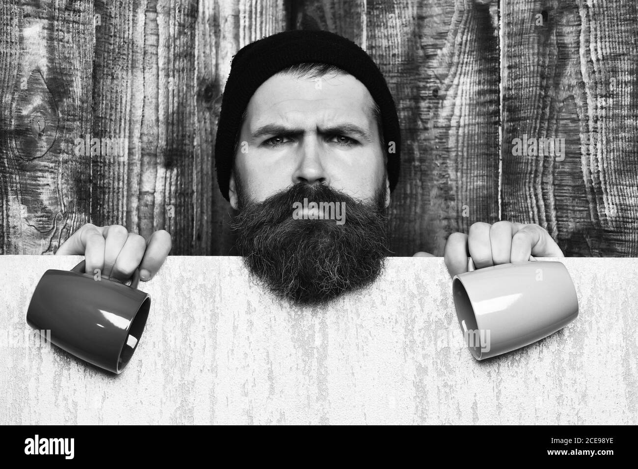 Bearded man, long beard. Brutal caucasian angry unshaven hipster in ... Bearded man, long beard. Brutal caucasian angry unshaven hipster in ...