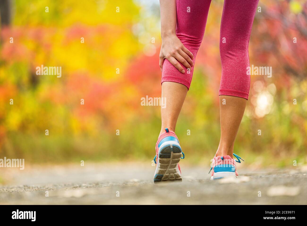 Leg muscle cramp calf sport injury outdoors exercise Stock Photo - Alamy