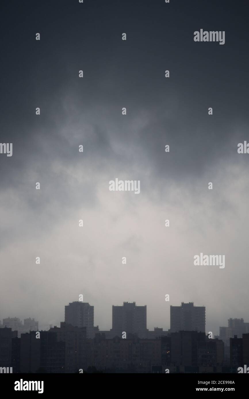Gloomy dark city view on typical generic houses and dark cloudy sky ...