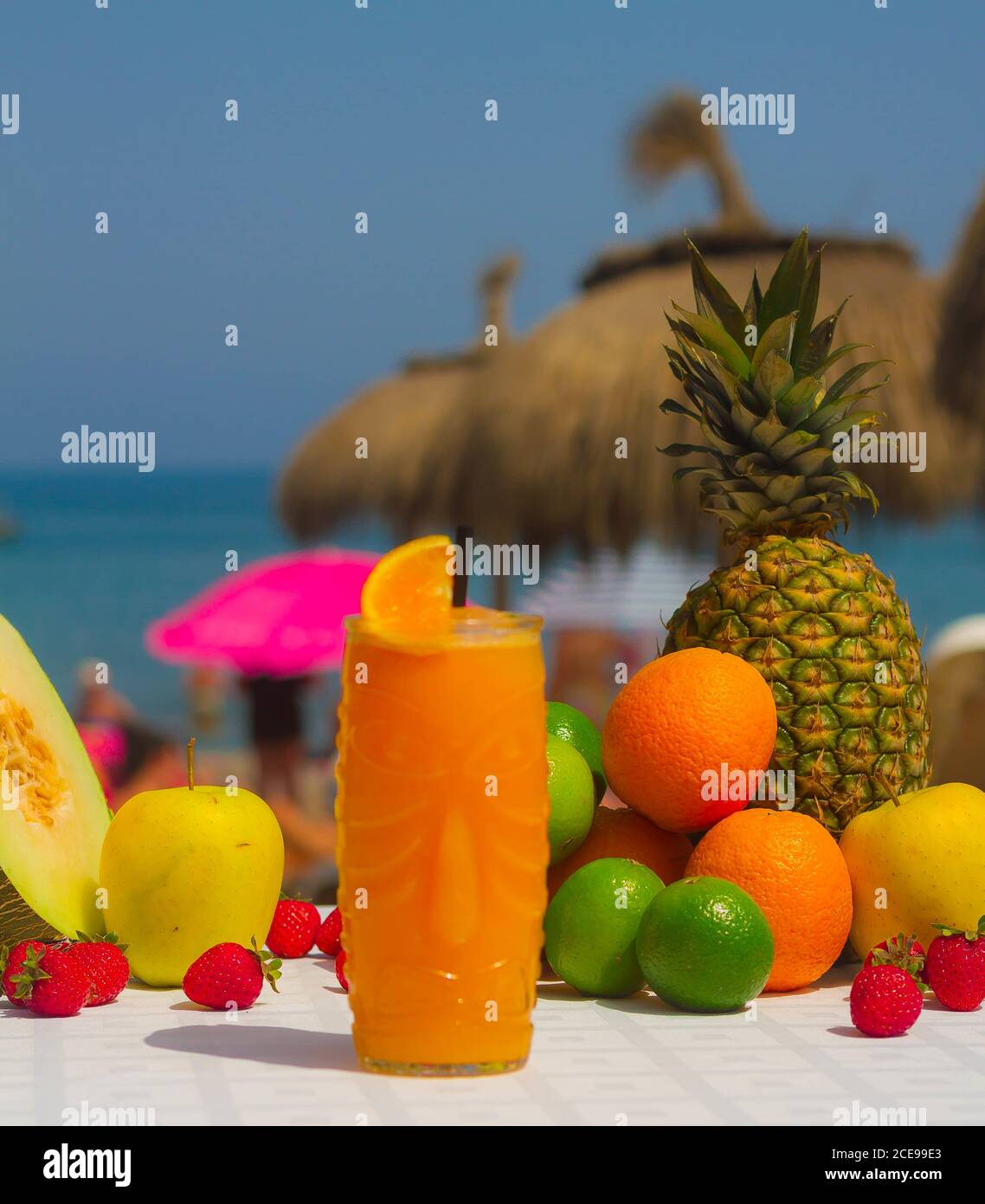 Perfect tropical cocktail juice with a paper parasol and fresh fruits ...