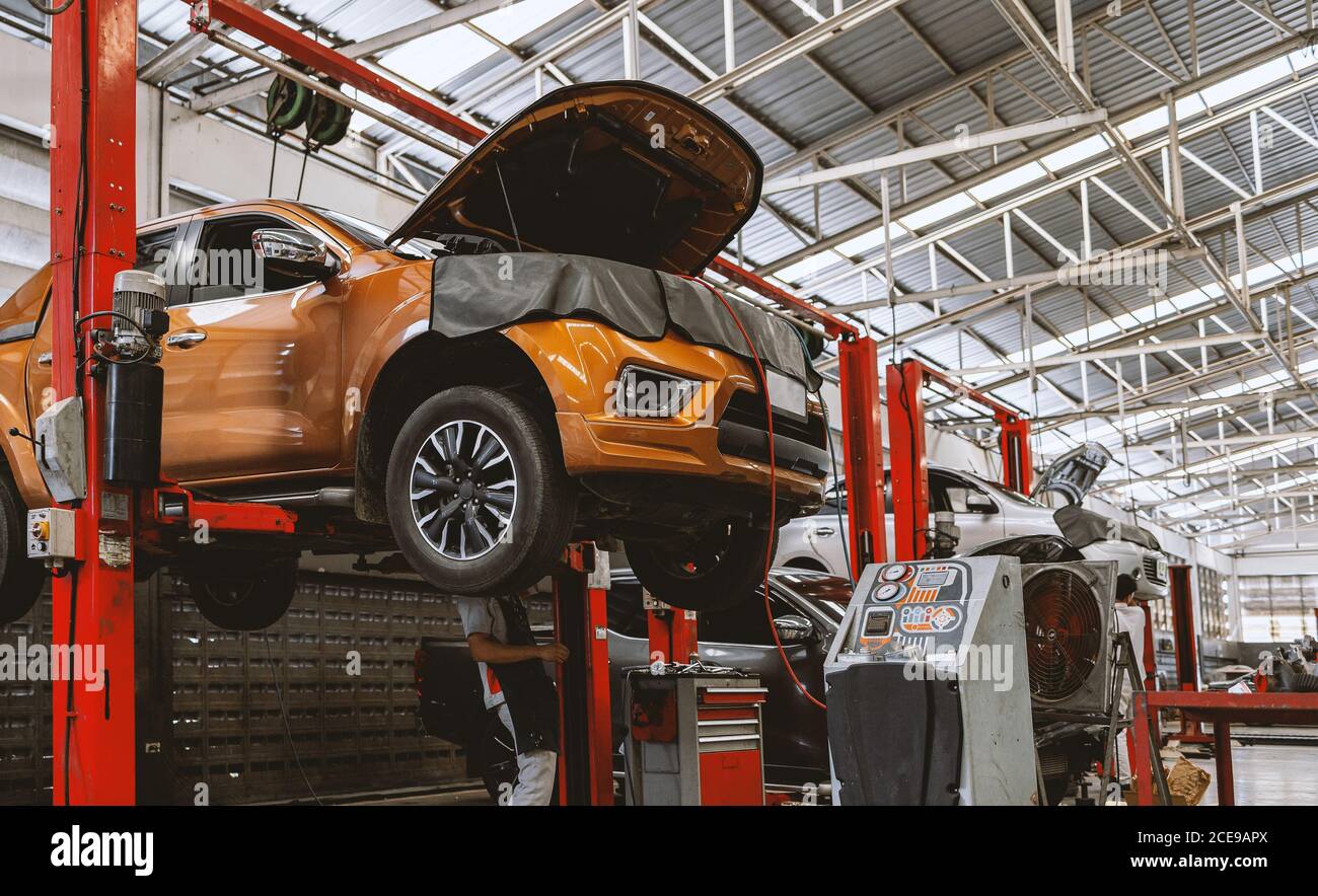 car in automobile repair service center with soft-focus and over light ...