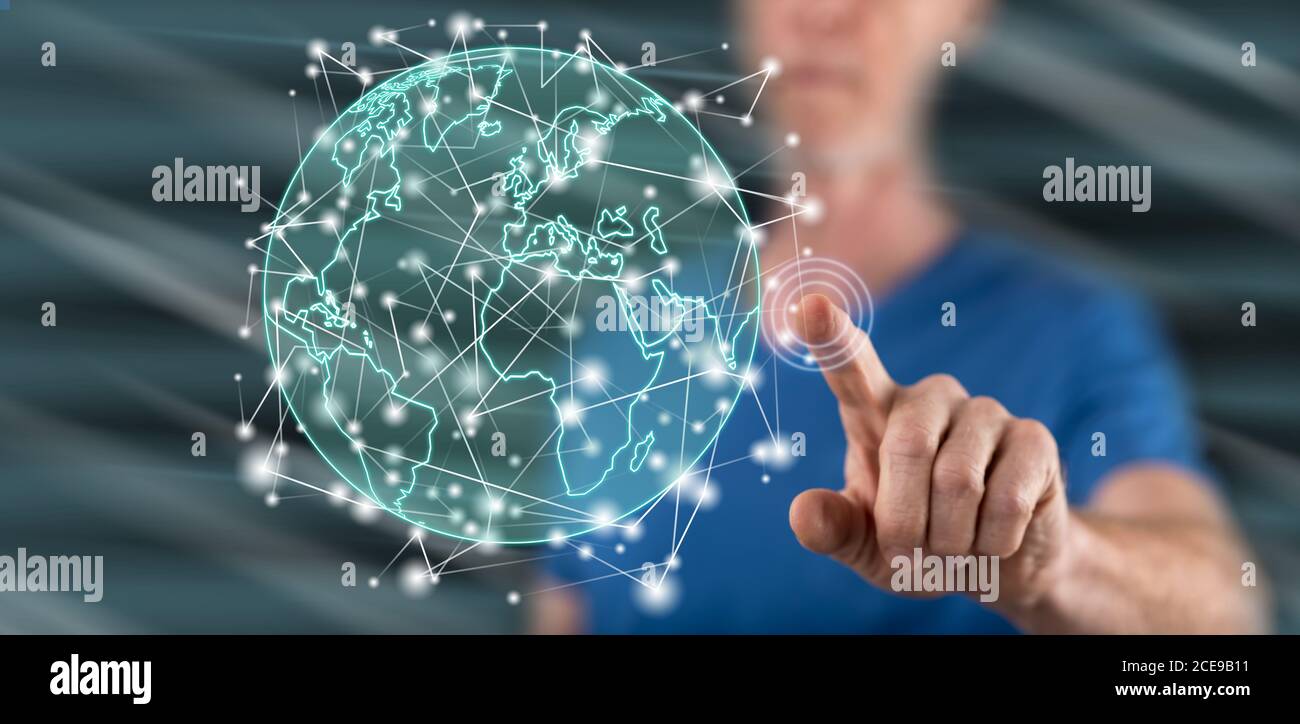 Man touching a global connection concept on a touch screen with his ...