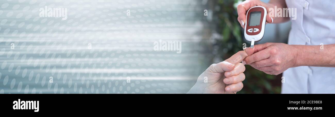 Nurse checking blood sugar level. panoramic banner Stock Photo - Alamy
