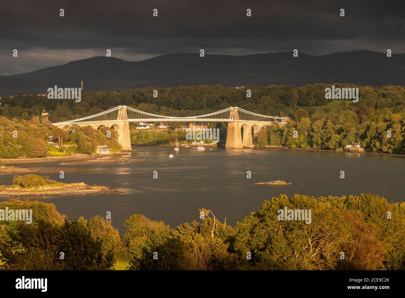 Telford suspension bridge in sunlight, Menai Straits, North Wales Stock ...