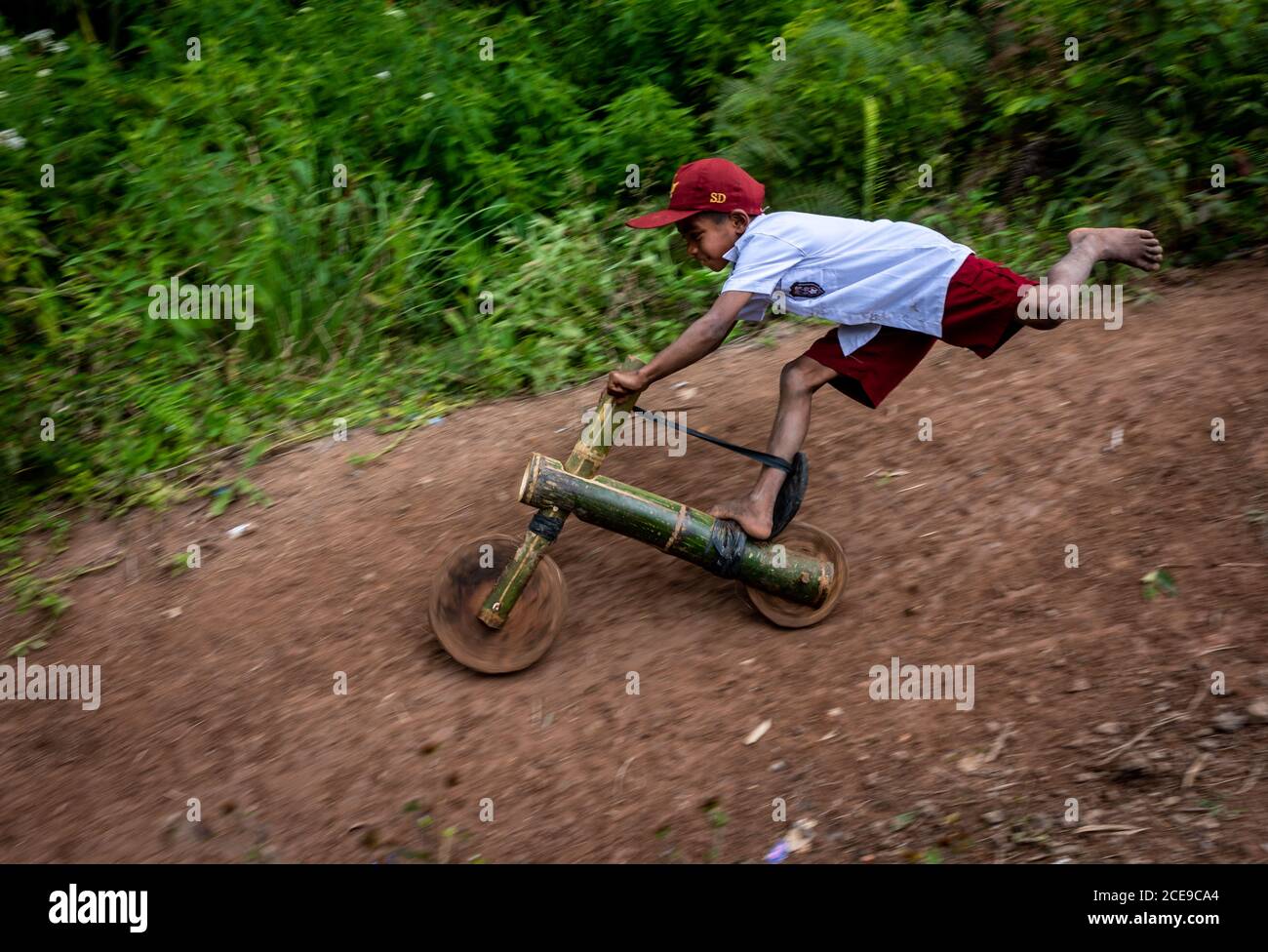 Child on bamboo bike hi-res stock photography and images - Alamy