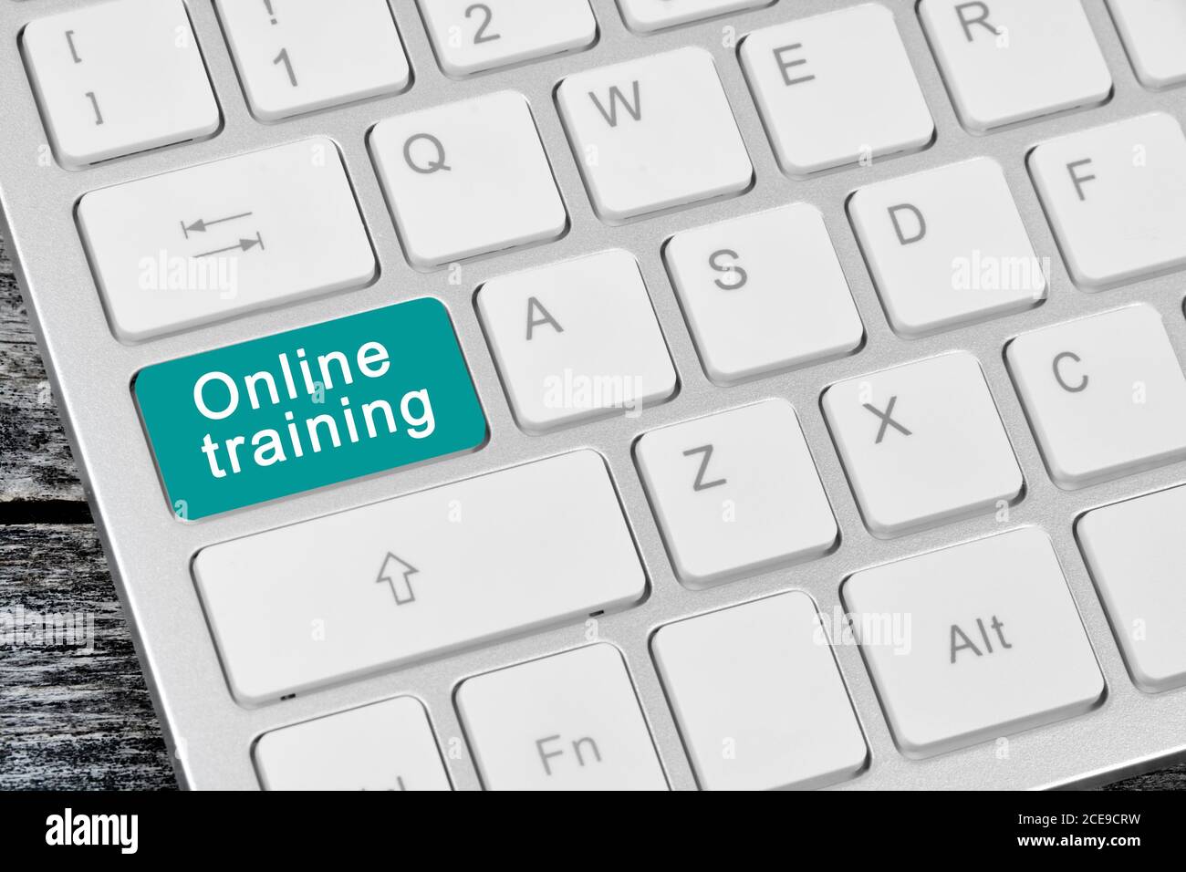 Keyboard with blue key word Online Training button close-up Stock Photo ...