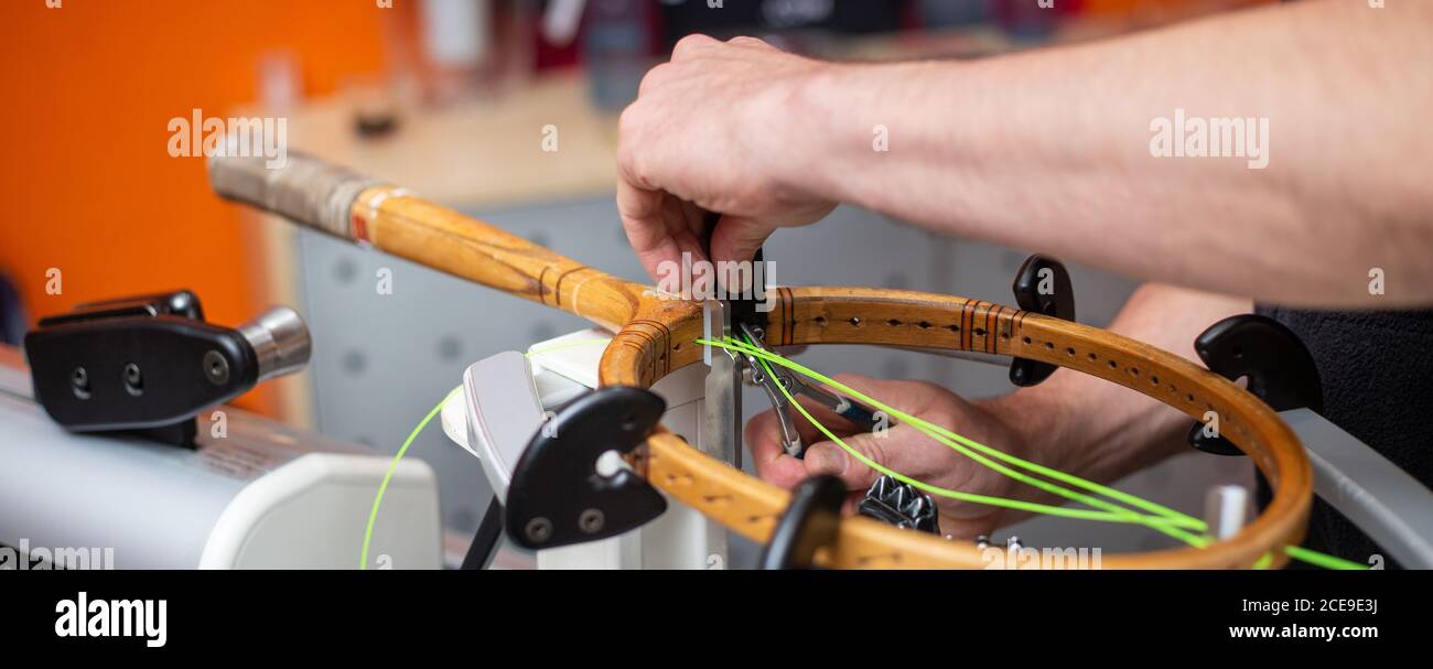Process of stringing a tennis racket in a tennis shop, sport and ...