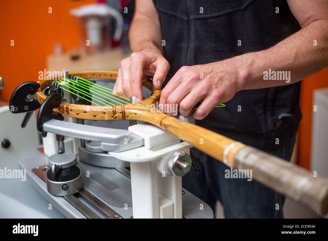 Process of stringing a tennis racket in a tennis shop, sport and ...