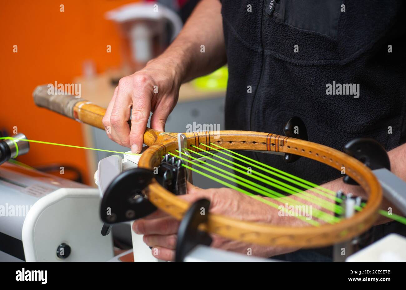 Process of stringing a tennis racket in a tennis shop, sport and ...