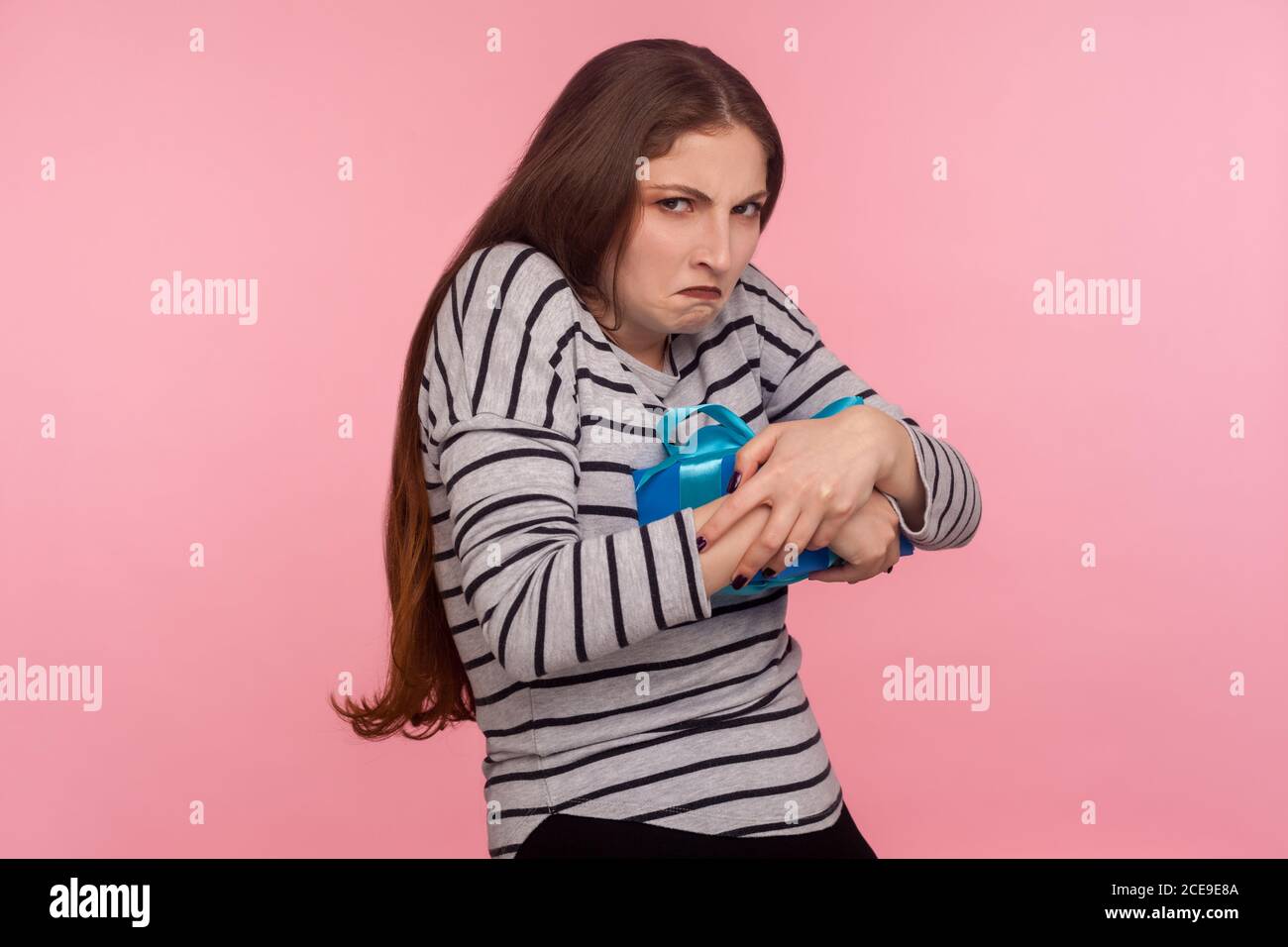 My precious! Portrait of funny selfish avaricious woman embracing gift ...