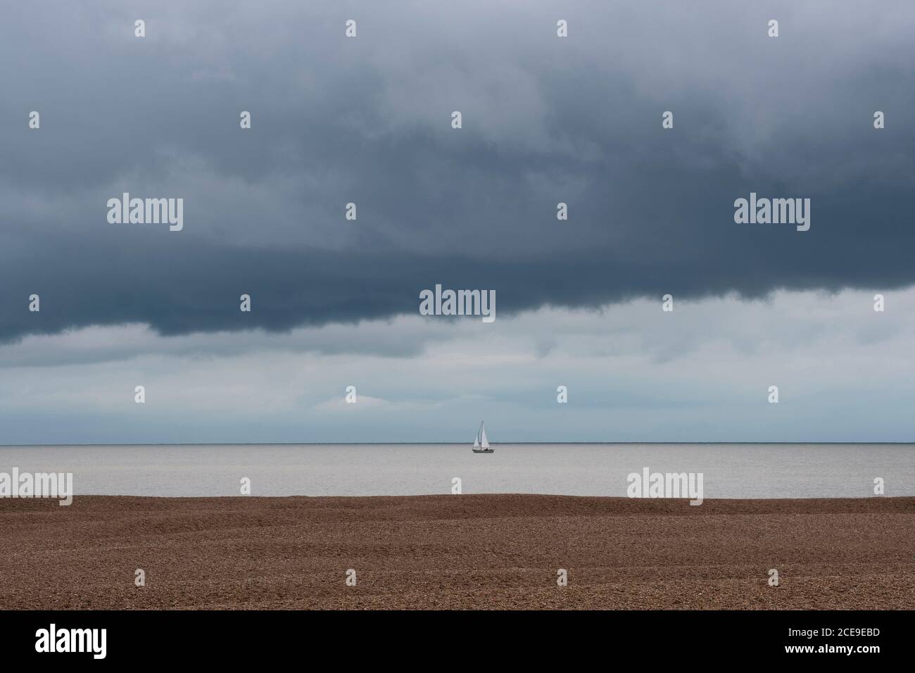 Storm clouds over Shingle Street Beach in Suffolk, UK Stock Photo - Alamy