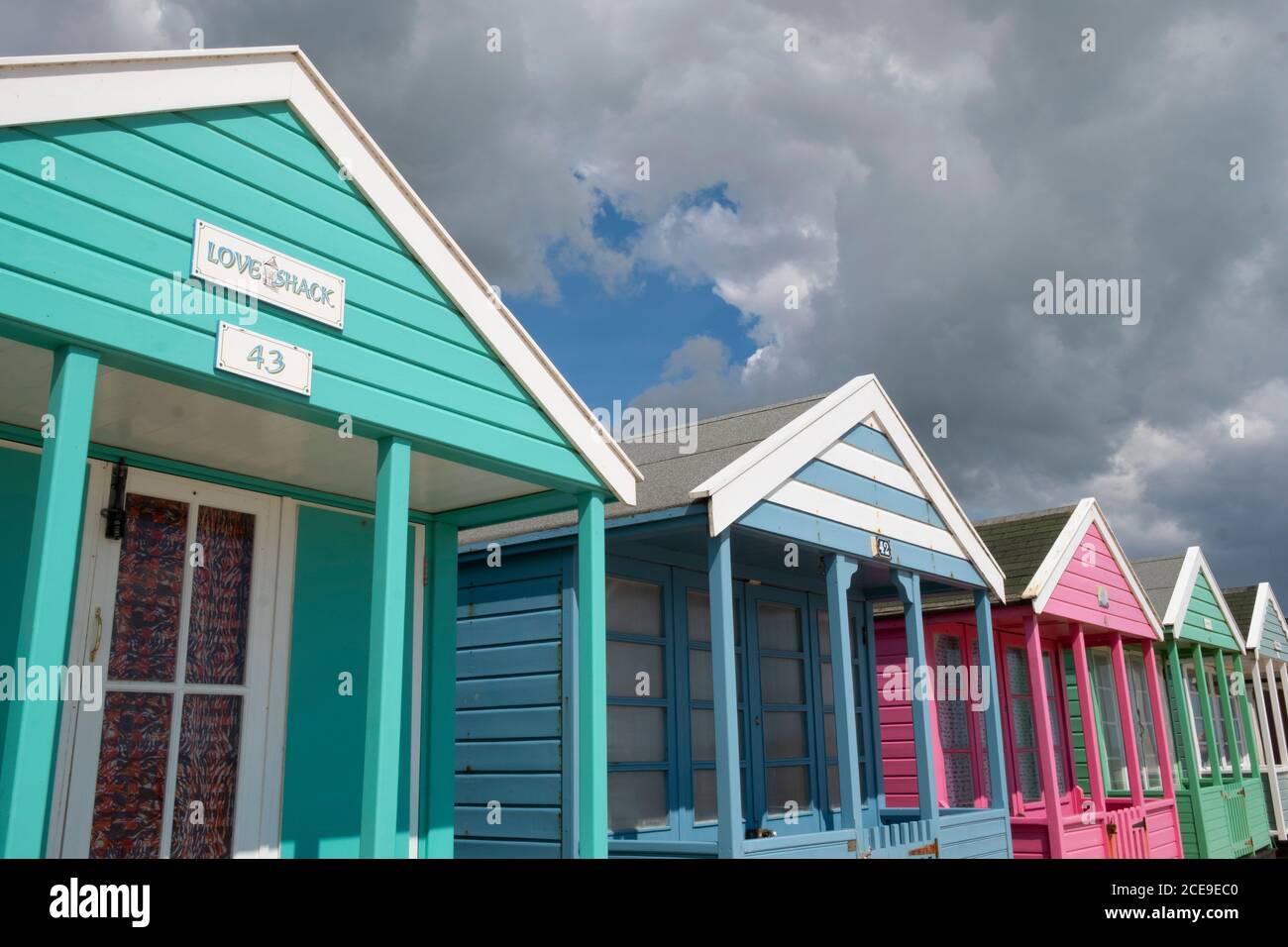 Traditional colourfullly painted wooden beach huts in Southwold ...