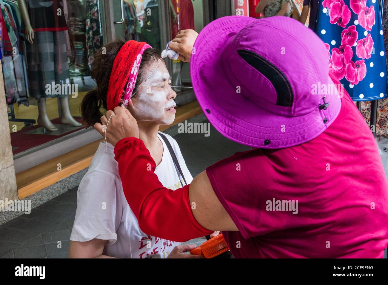 NEW TAIPEI CITY, TAIWAN - JULY 23: Unidentified woman gets a ...