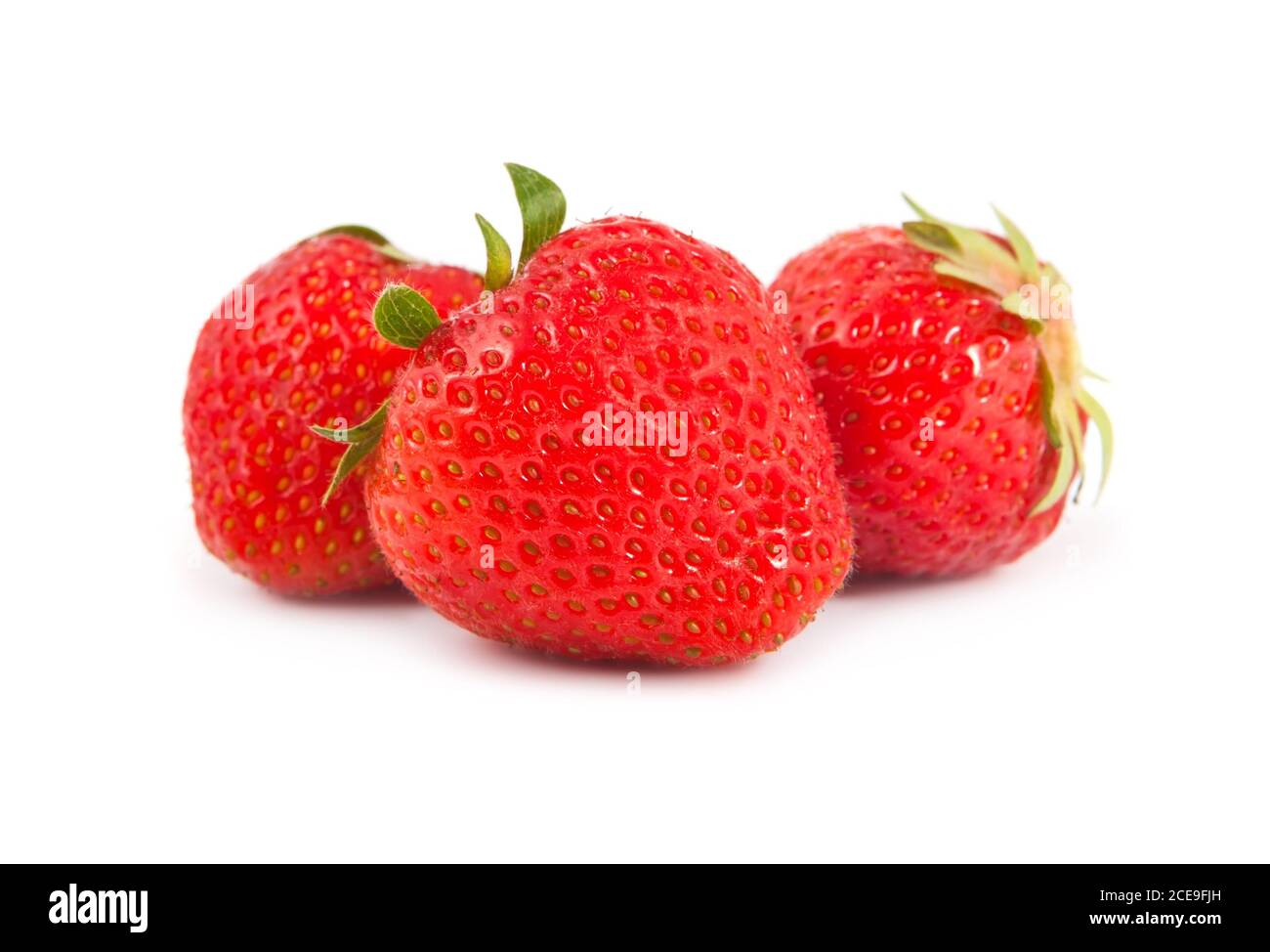 Three ripe strawberry Stock Photo - Alamy
