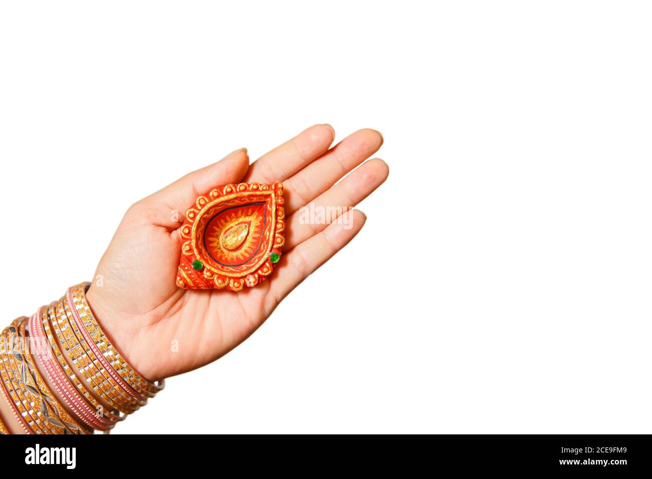 Happy Diwali - Woman hands with henna holding lit candle isolated on ...