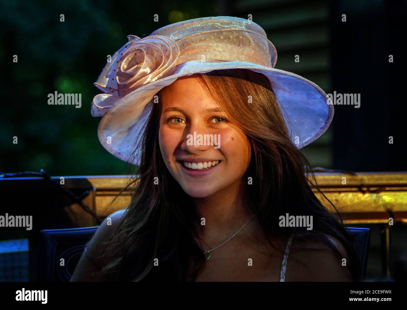 A woman models a vintage hat in the evening sun Stock Photo - Alamy