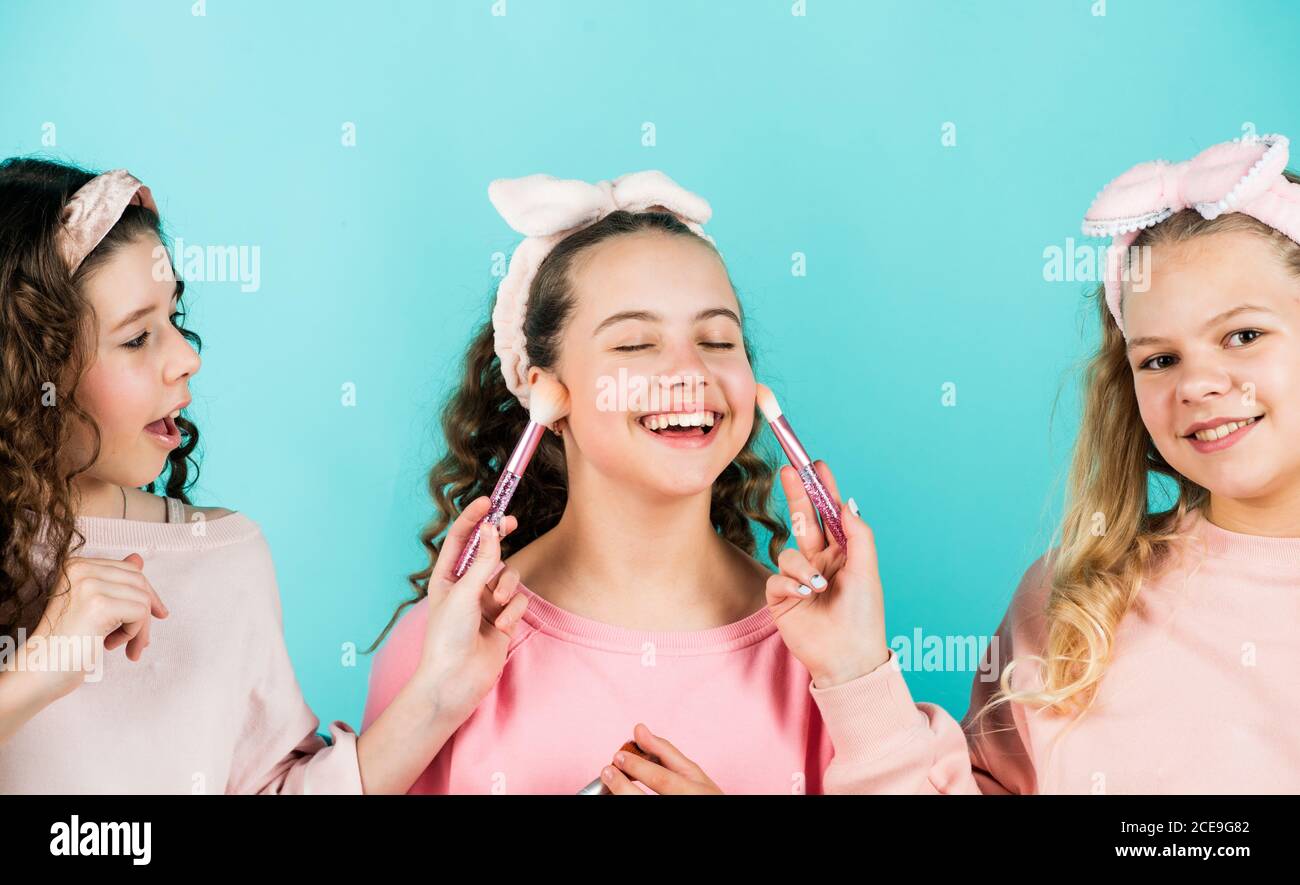 Happy girls doing makeup together. Sisterhood happiness. Skin care ...