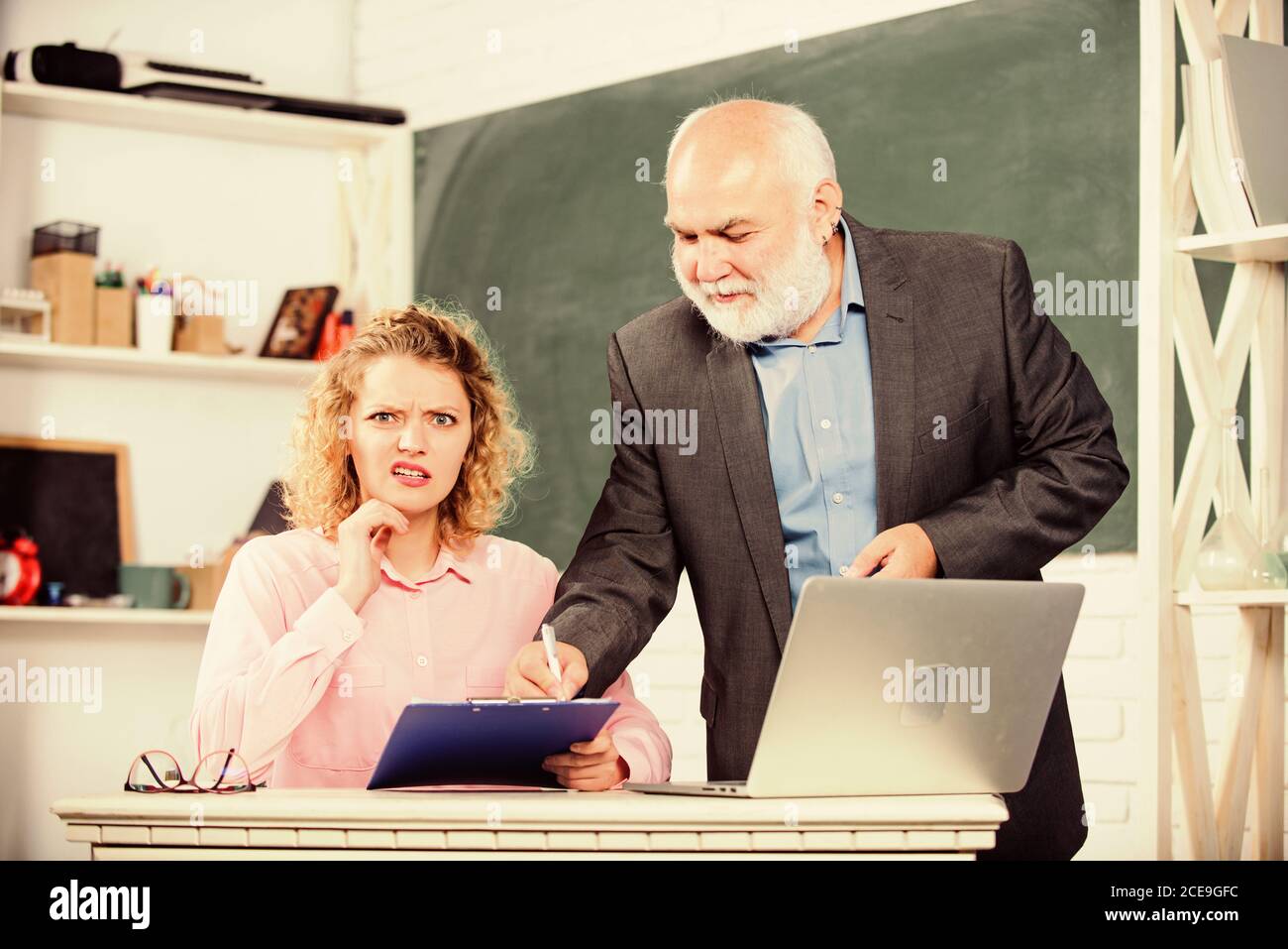 Spare time. student and tutor with laptop. student girl with tutor man ...