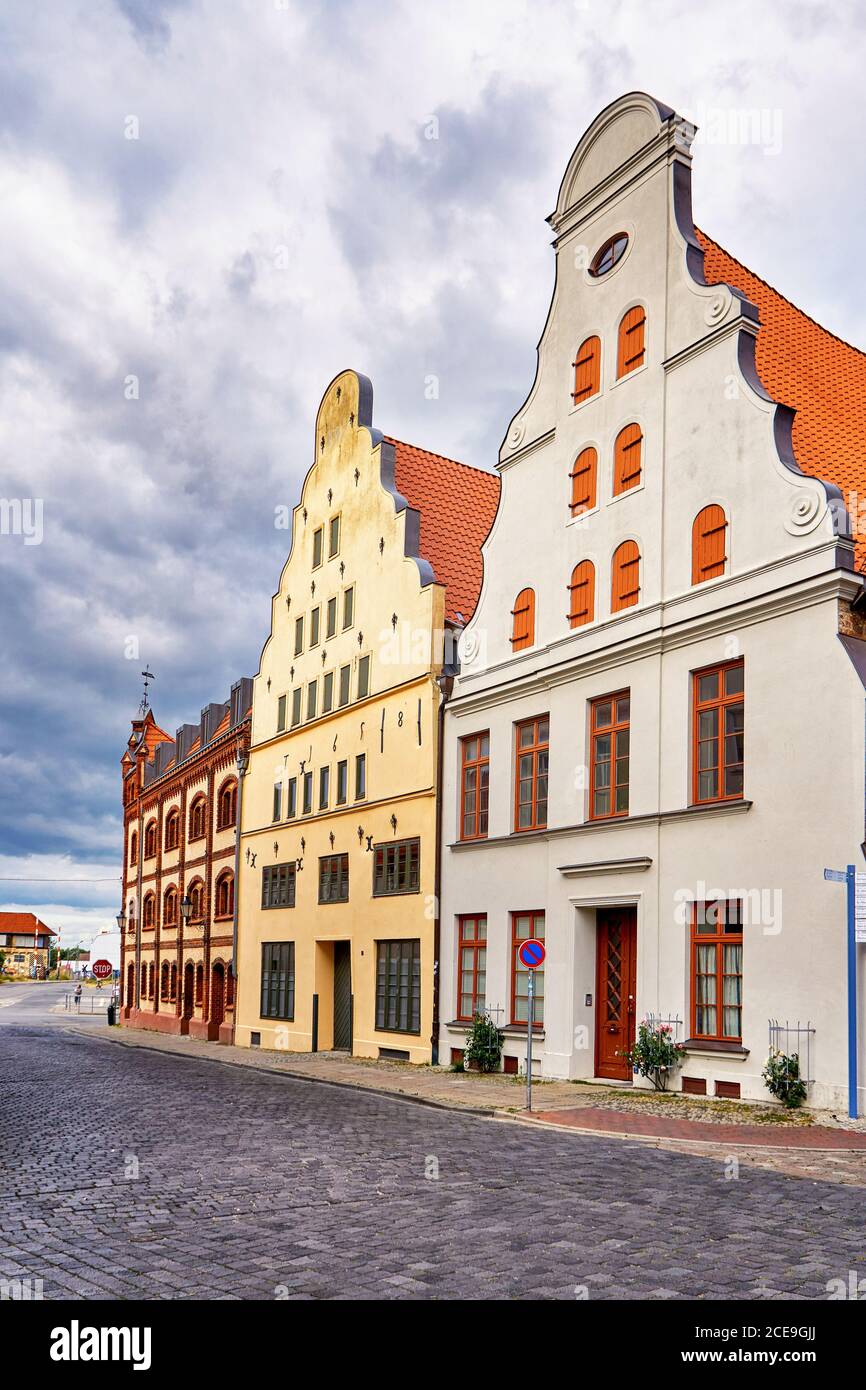 Street with old gabled house facades in the old town of Wismar Stock Photo - Alamy