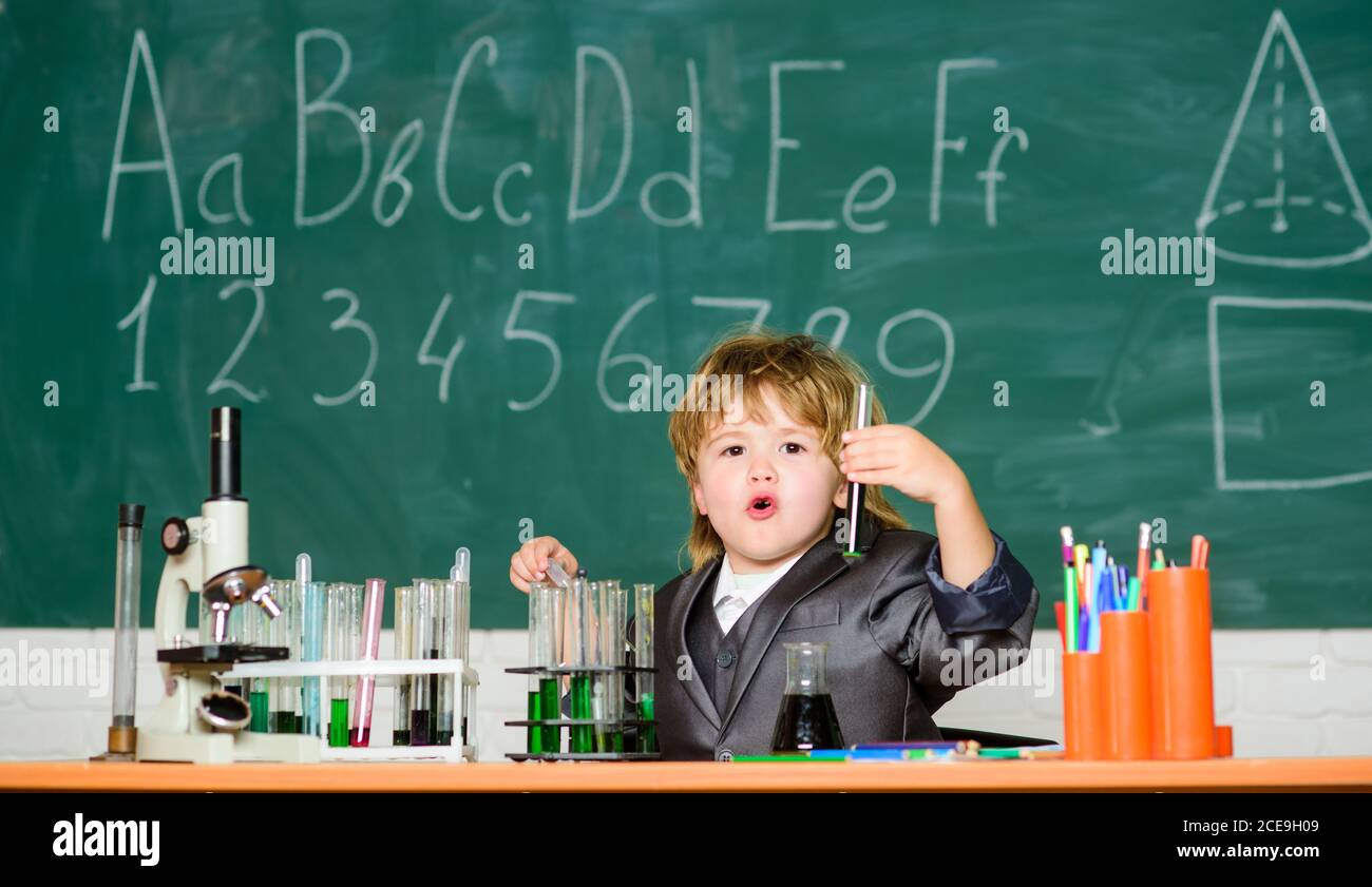 Back to school. Pupil looking through microscope . student do science ...