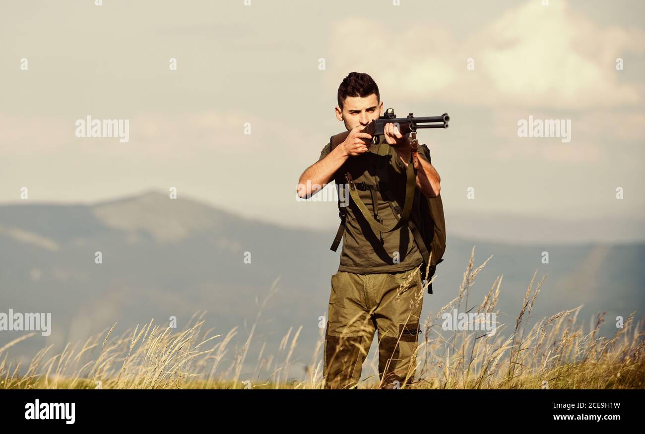 soldier in the field. polygon. muscular man hold weapon. purpose and ...