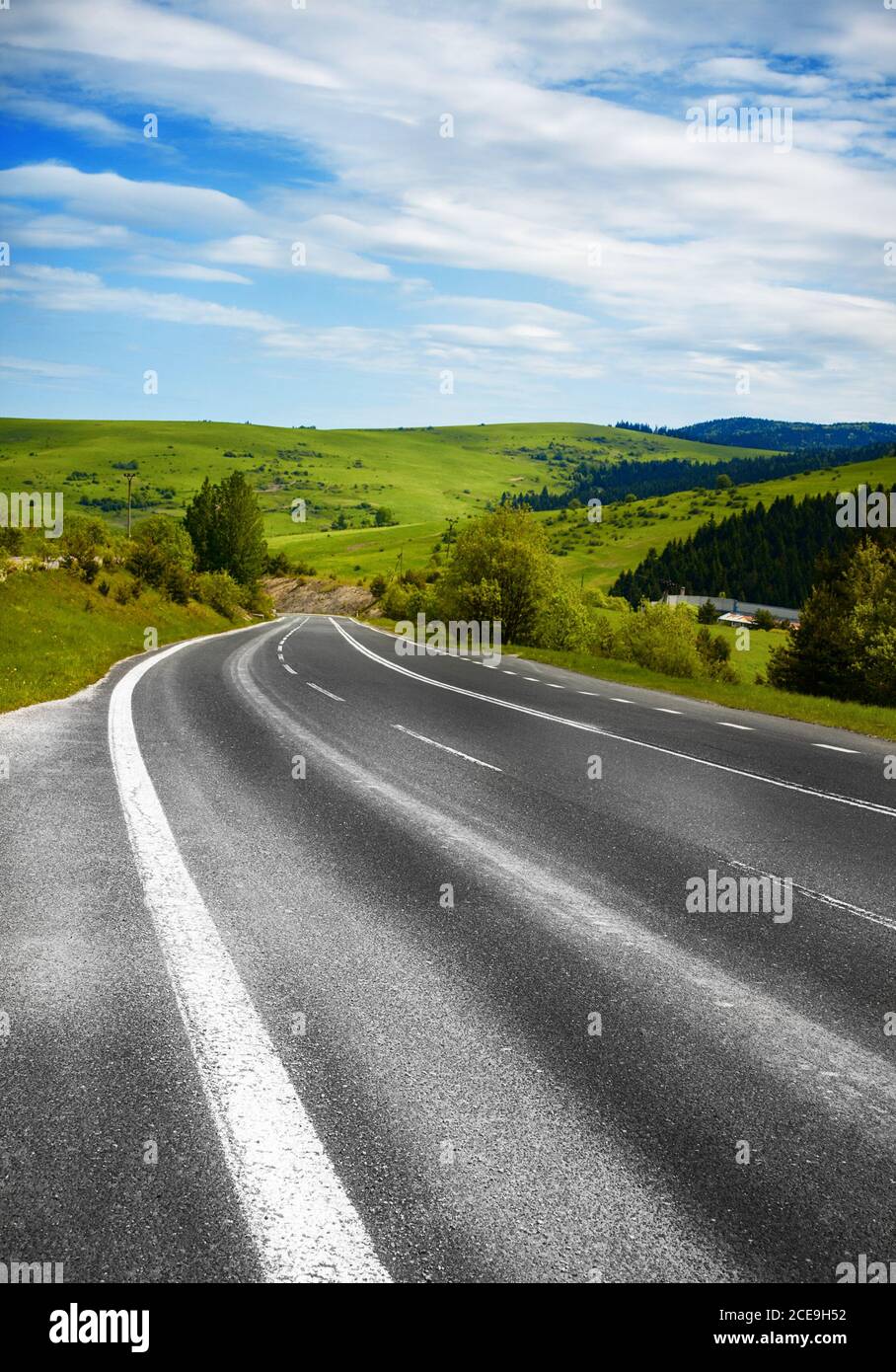Empty curved road Stock Photo - Alamy